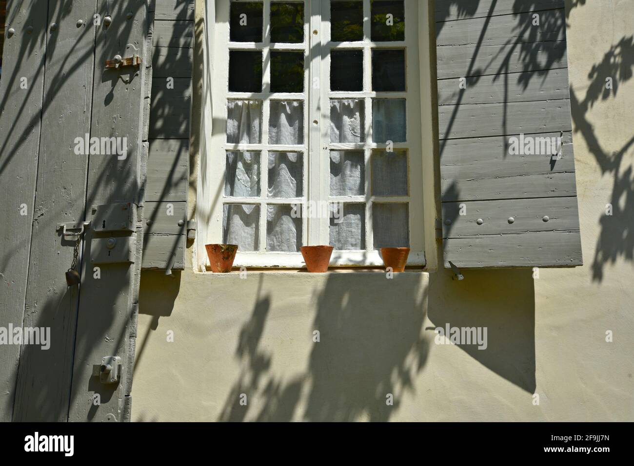 Typical Provençal style rural house window with light grey wooden ...