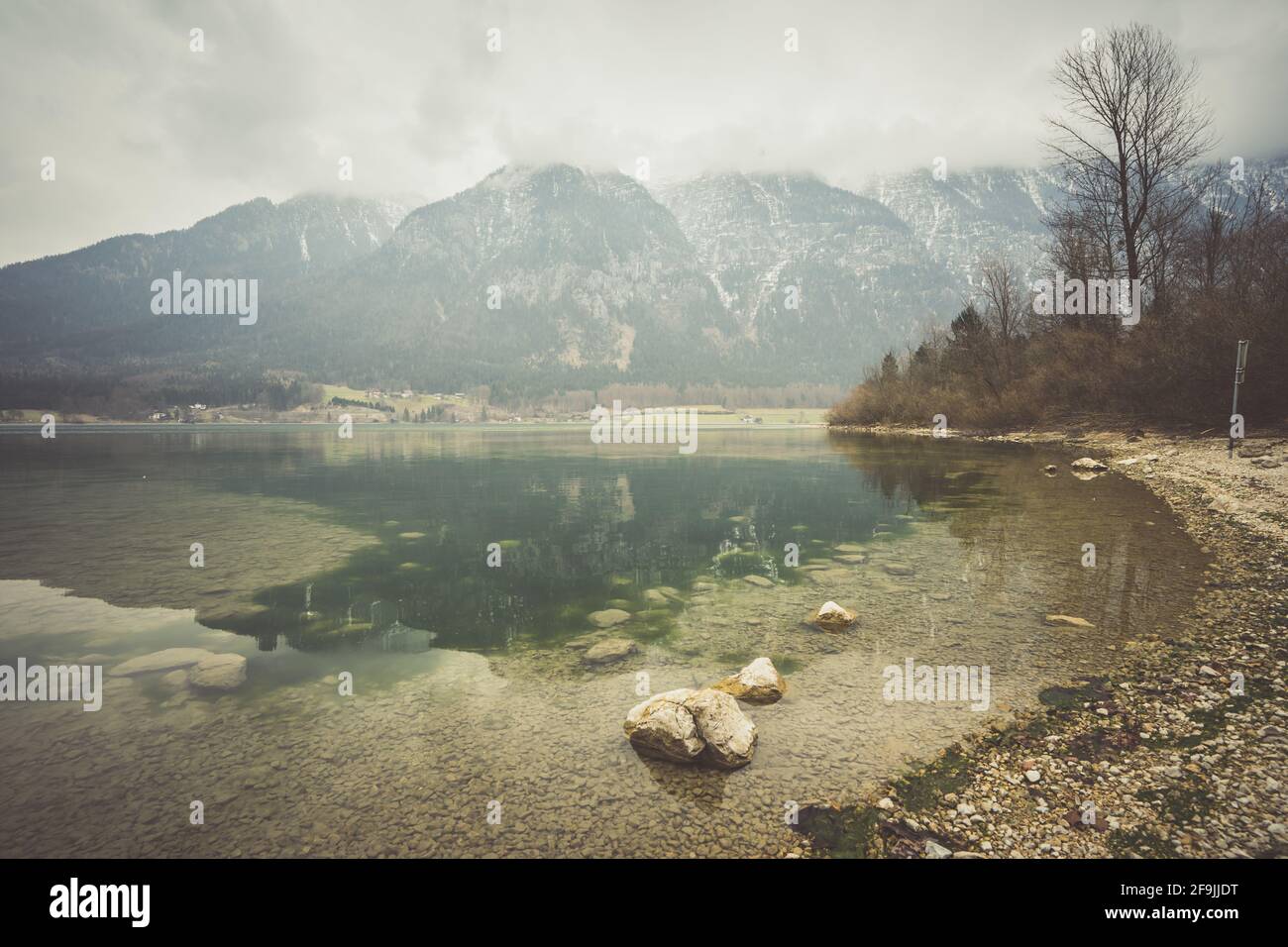 Mesmerizing landscape with misty mountains and their reflection in ...