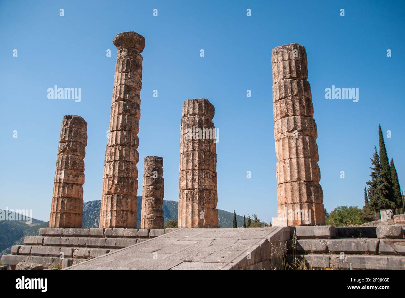 Ancient columns of the Temple of Apollo at Delphi, Greece Stock Photo ...