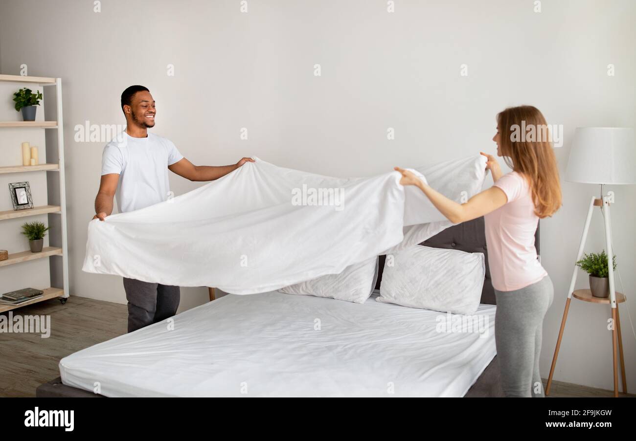 Young couple making love bed hi-res stock photography and images - Alamy