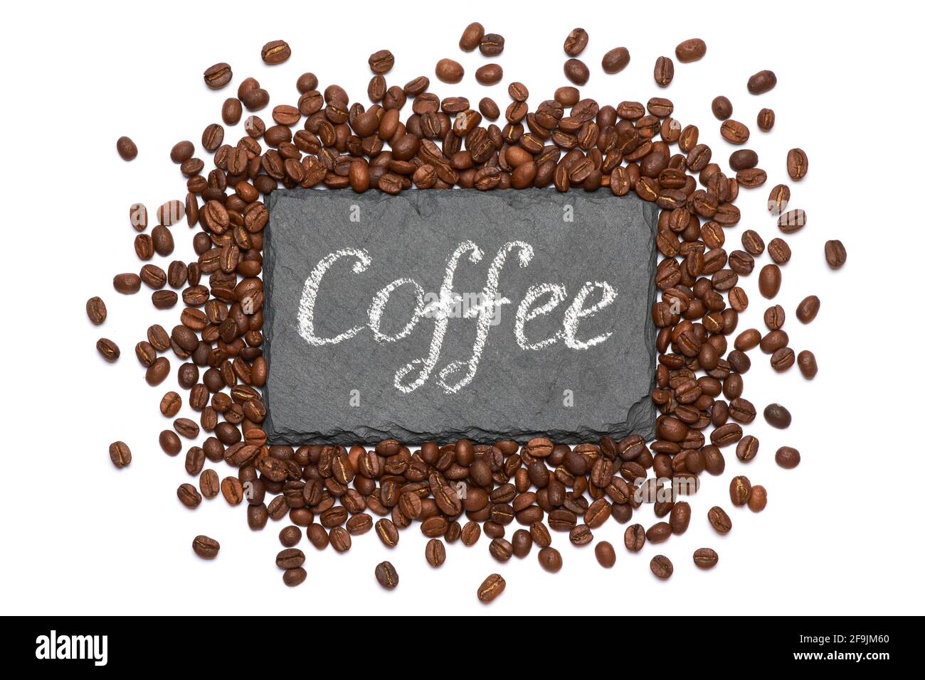 stone serving board with chalk handwritten sign and coffee beans on ...