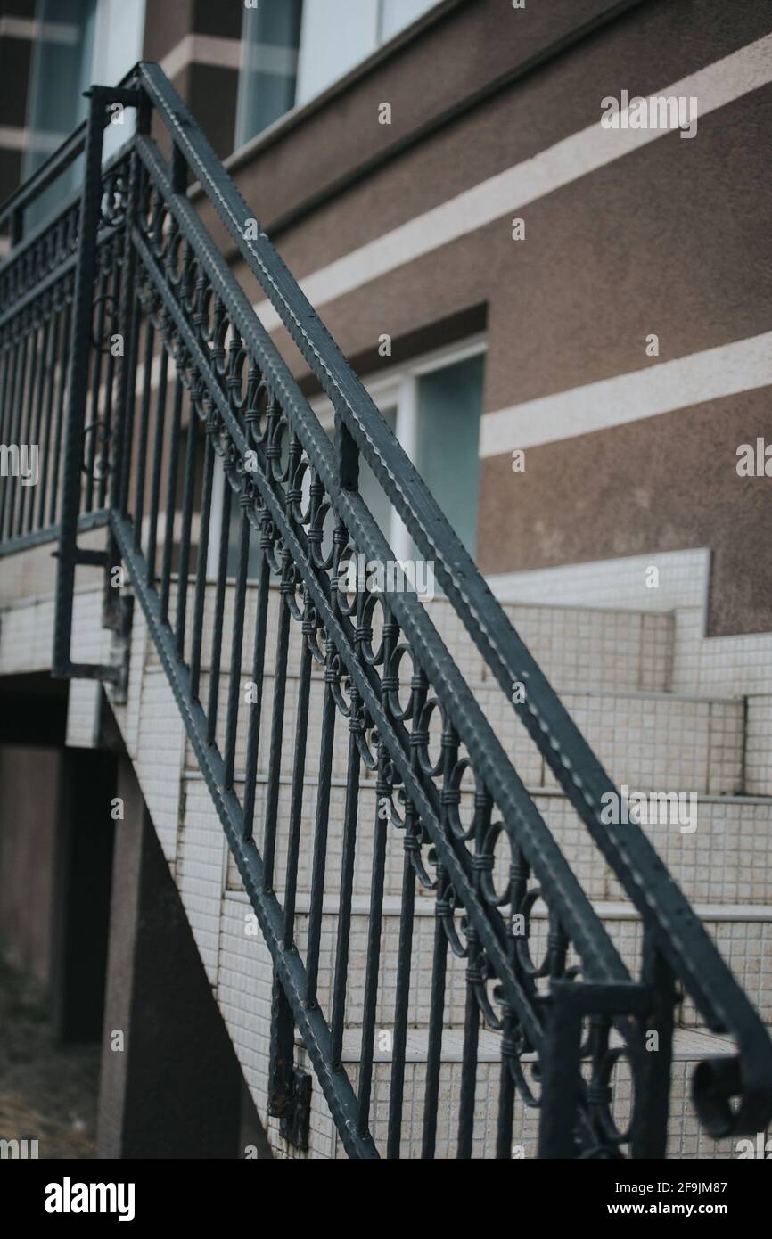 Vertical shot of an iron railing on the stairs Stock Photo - Alamy