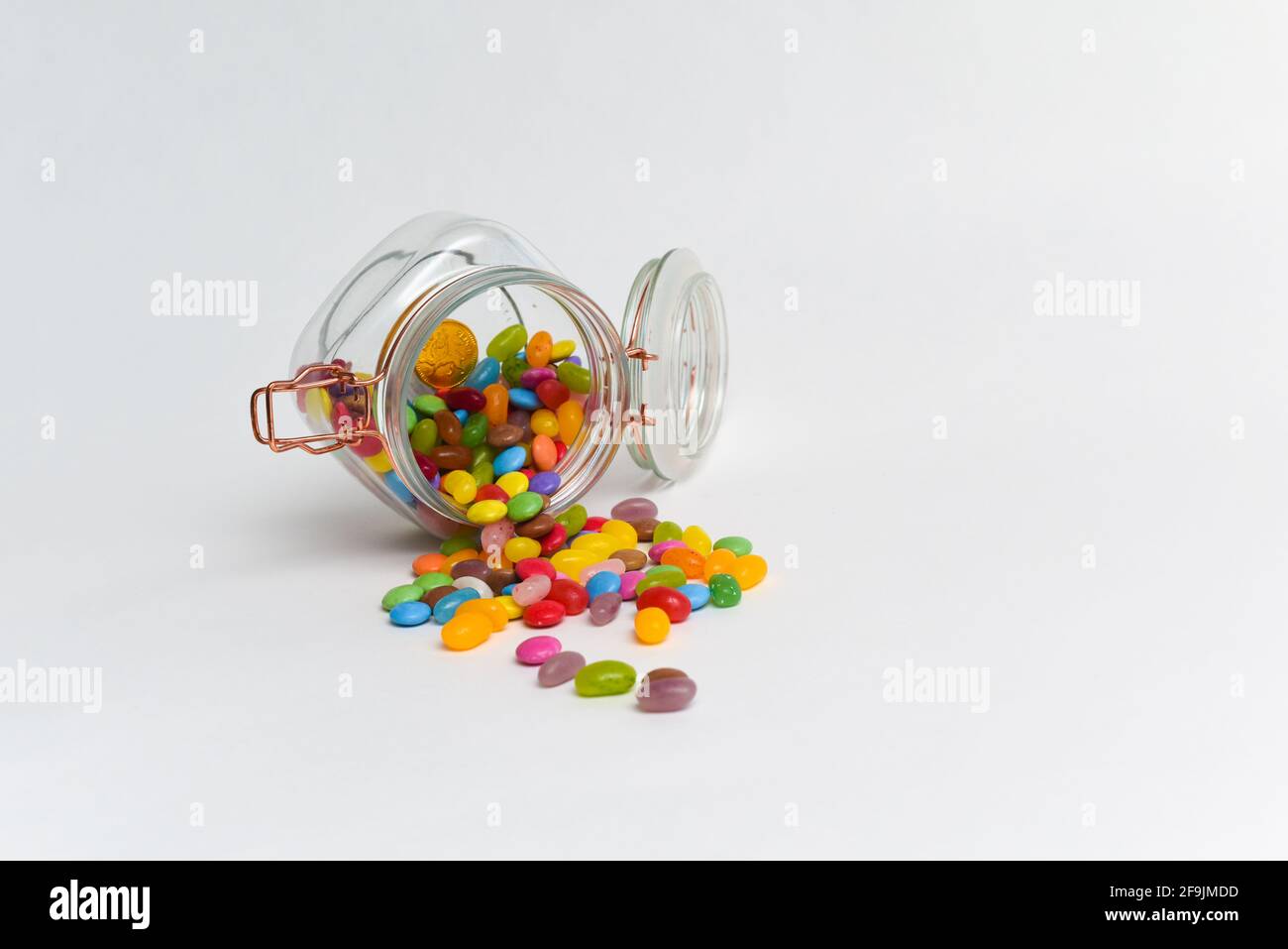 Junk food sweets and chocolate candy in a jar isolated Stock Photo - Alamy