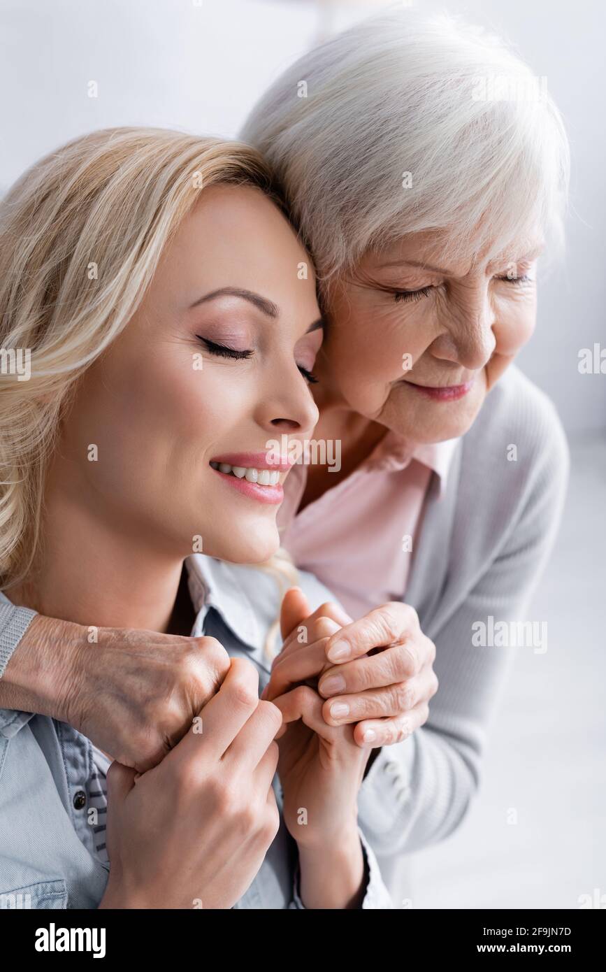 Elderly mother eyes closed daughter hi-res stock photography and images - Alamy