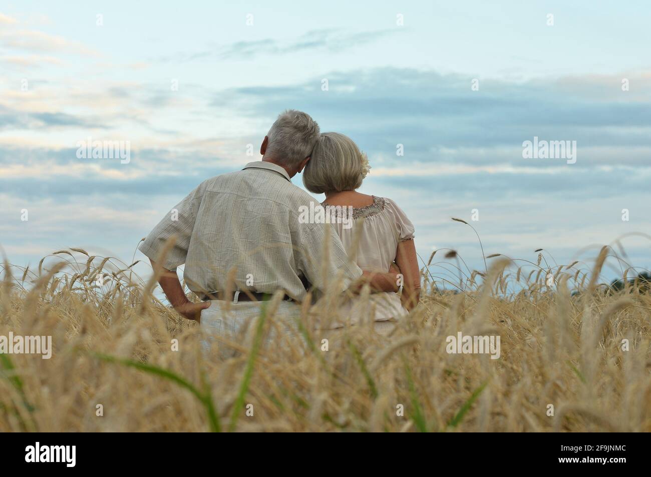Back view. Portrait of happy elderly couple resting Stock Photo - Alamy
