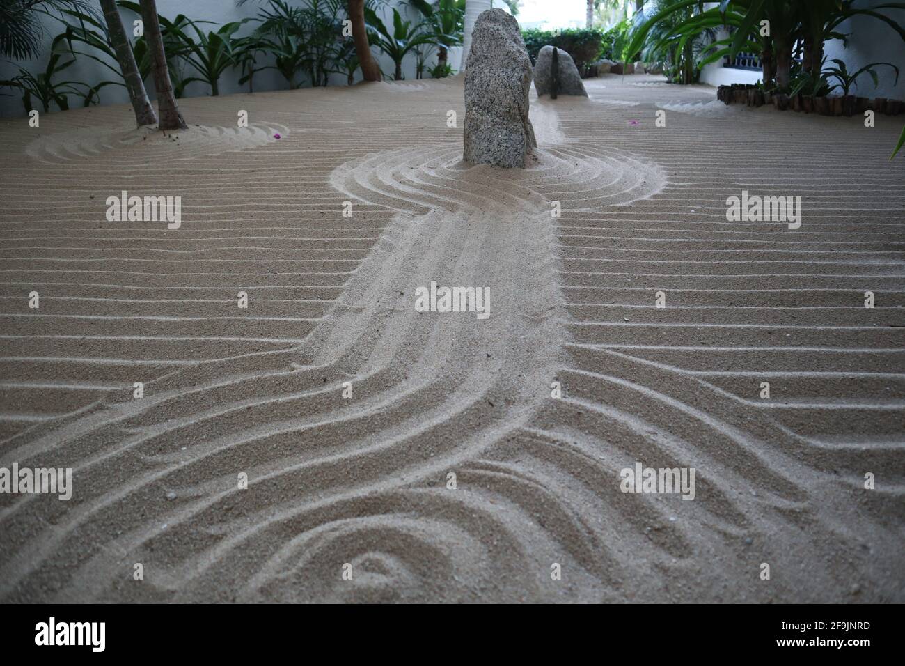 Closeup view a sand pattern by raking, at a luxury resort in Los Cabos ...