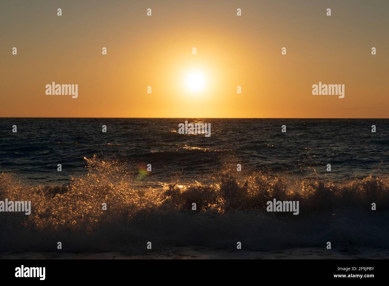 Golden beach and breaking waves hi-res stock photography and images - Alamy