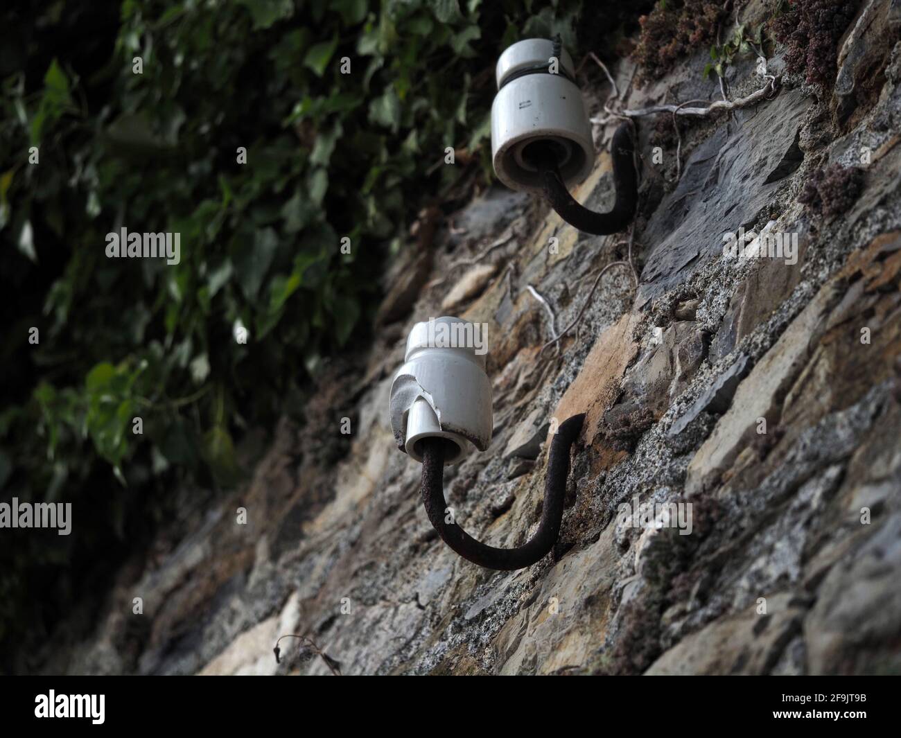 old ceramic telephone cable wire support detail Stock Photo - Alamy