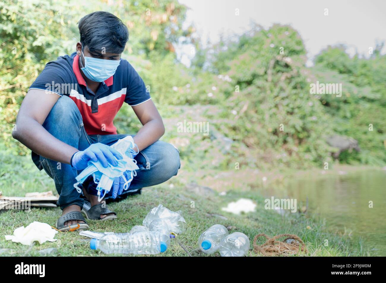 Frontline healthcare worker or waste collector busy collecting ...