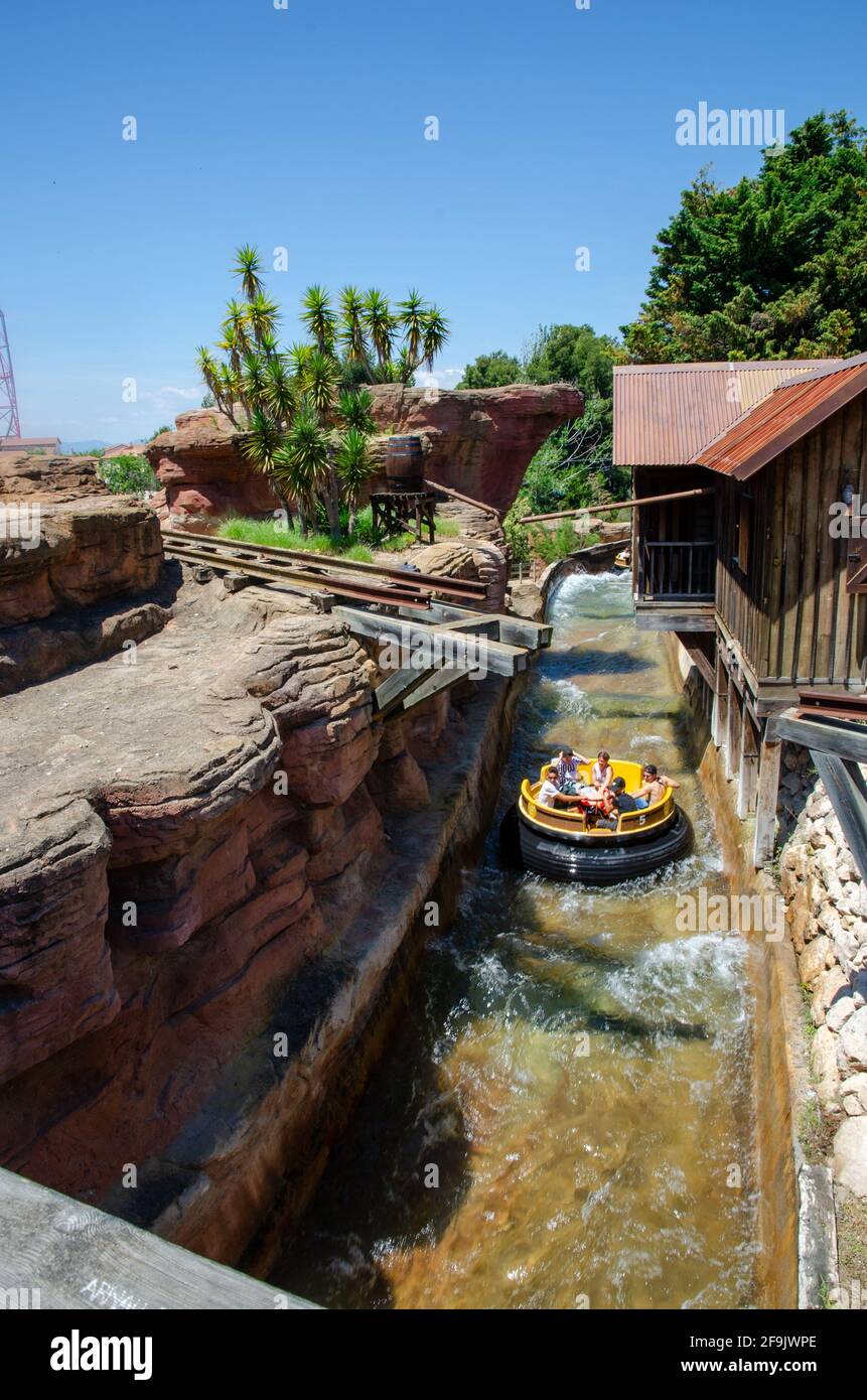 Water attractions in park Port Aventura Spain. Rafting in round boats ...