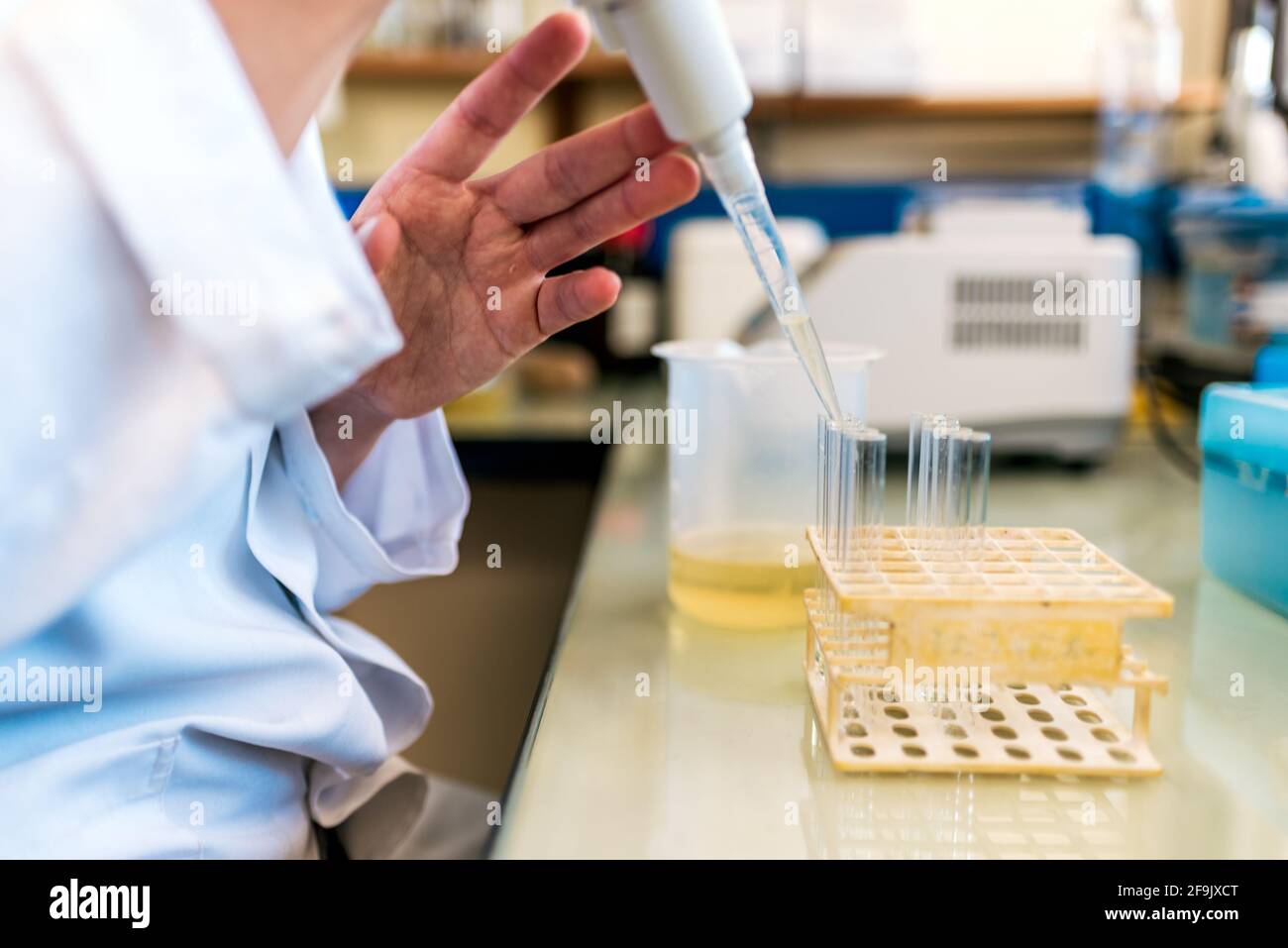 Scientist holding dropper test tube hi-res stock photography and images ...