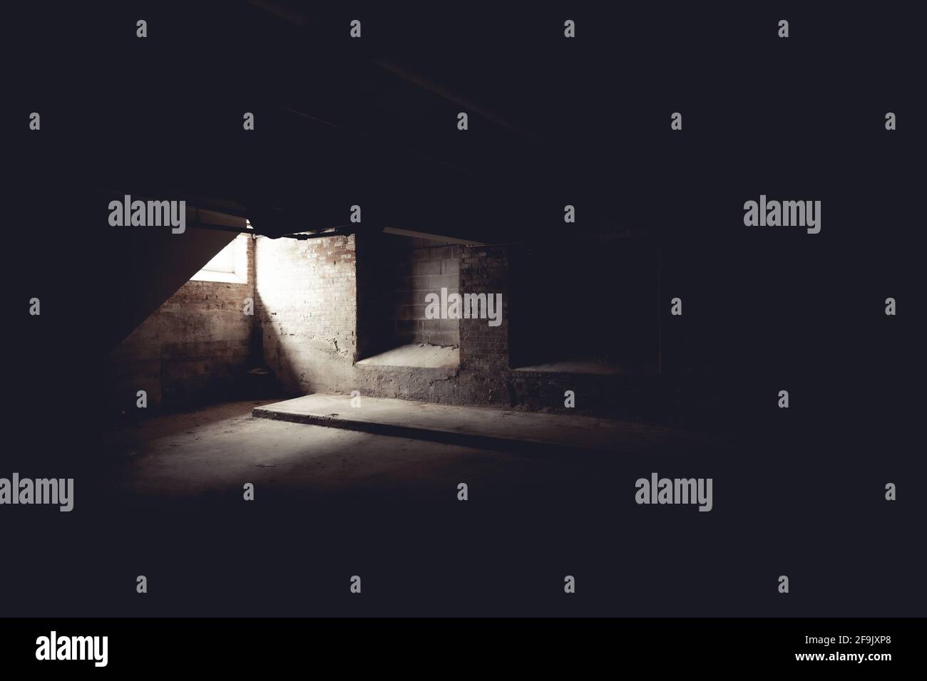 Light shining through a window into the dark basement Stock Photo - Alamy