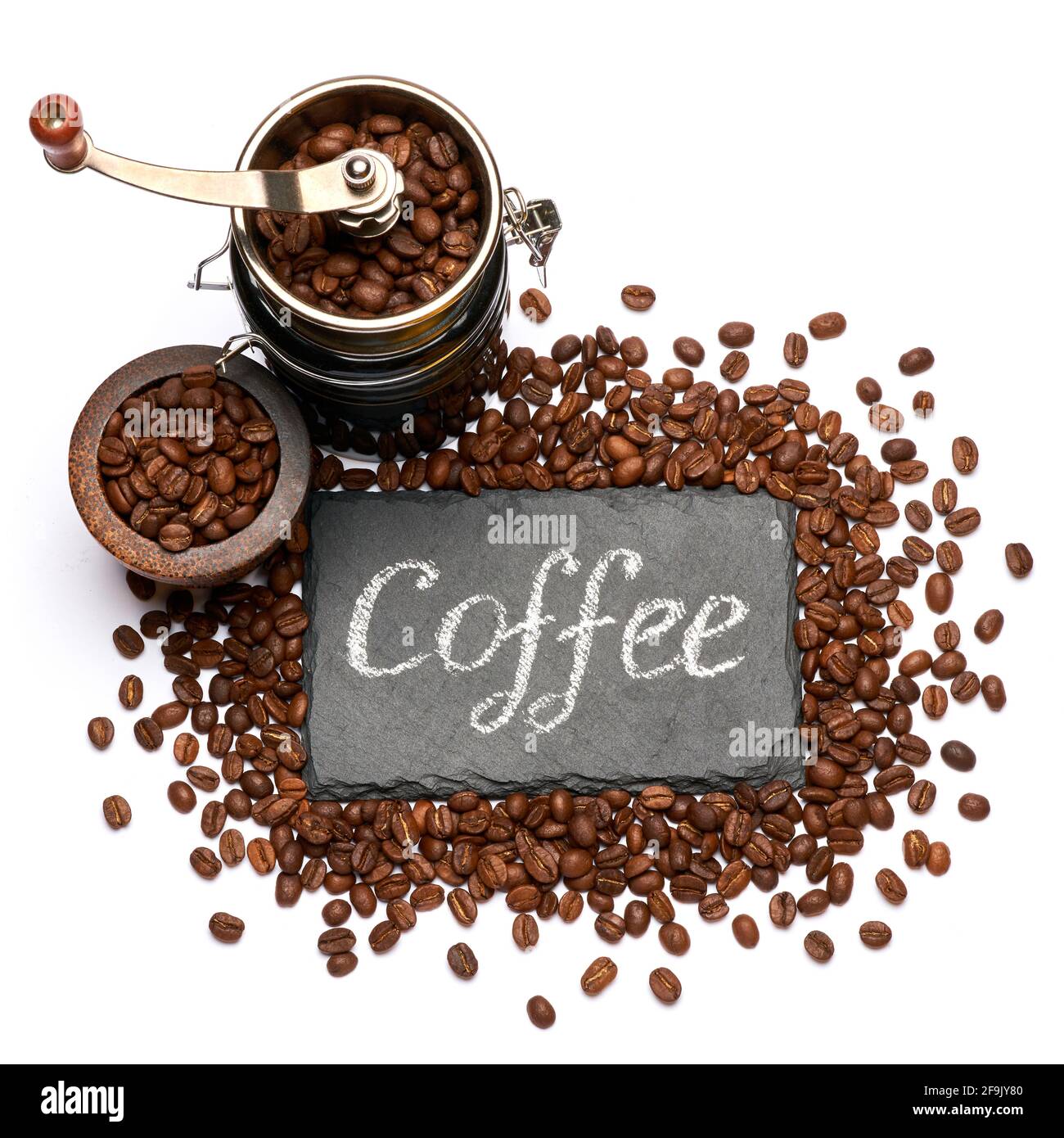 Coffee handwritten inscription sign on chalk board, coffee grinder and ...