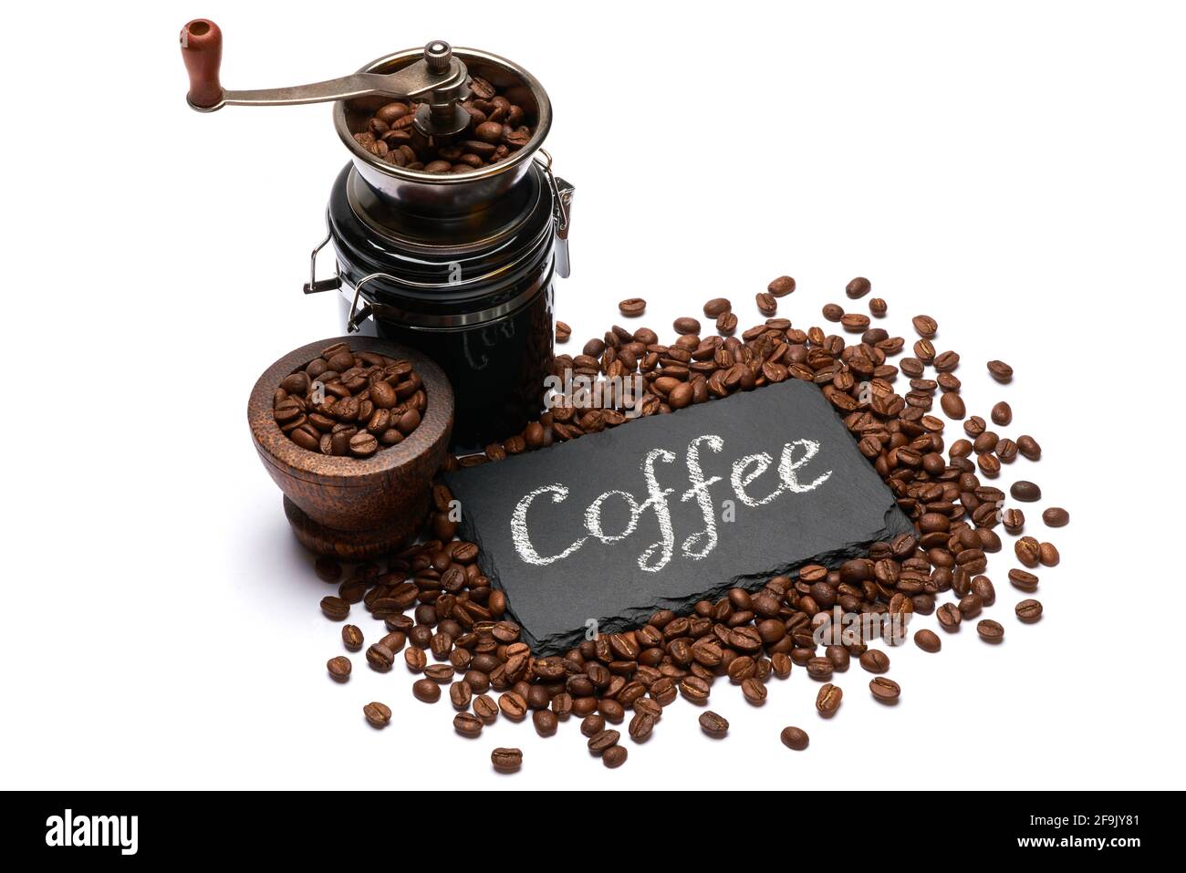 Coffee handwritten inscription sign on chalk board, coffee grinder and ...