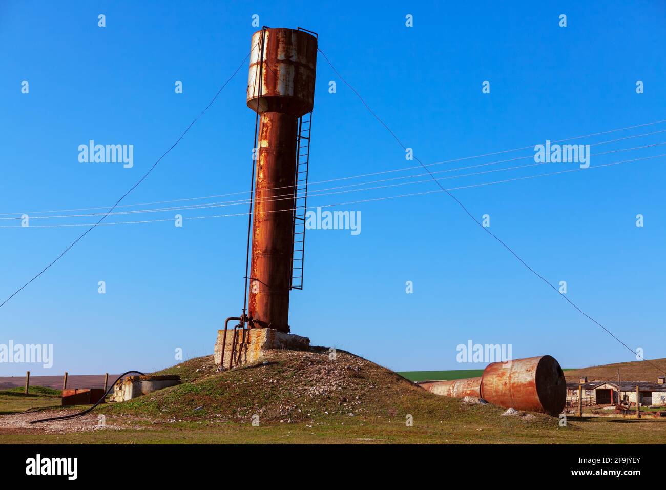 Rusty water tower . Old abandoned farm Stock Photo - Alamy