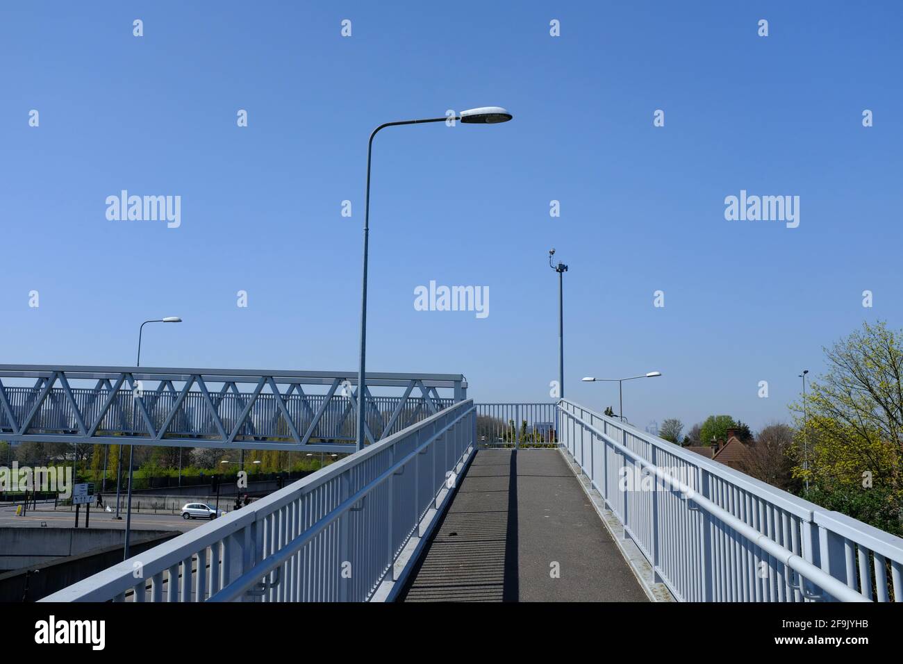 PLAISTOW, LONDON - 19TH APRIL 2021: Pedestrian foot bridge over the A13 ...