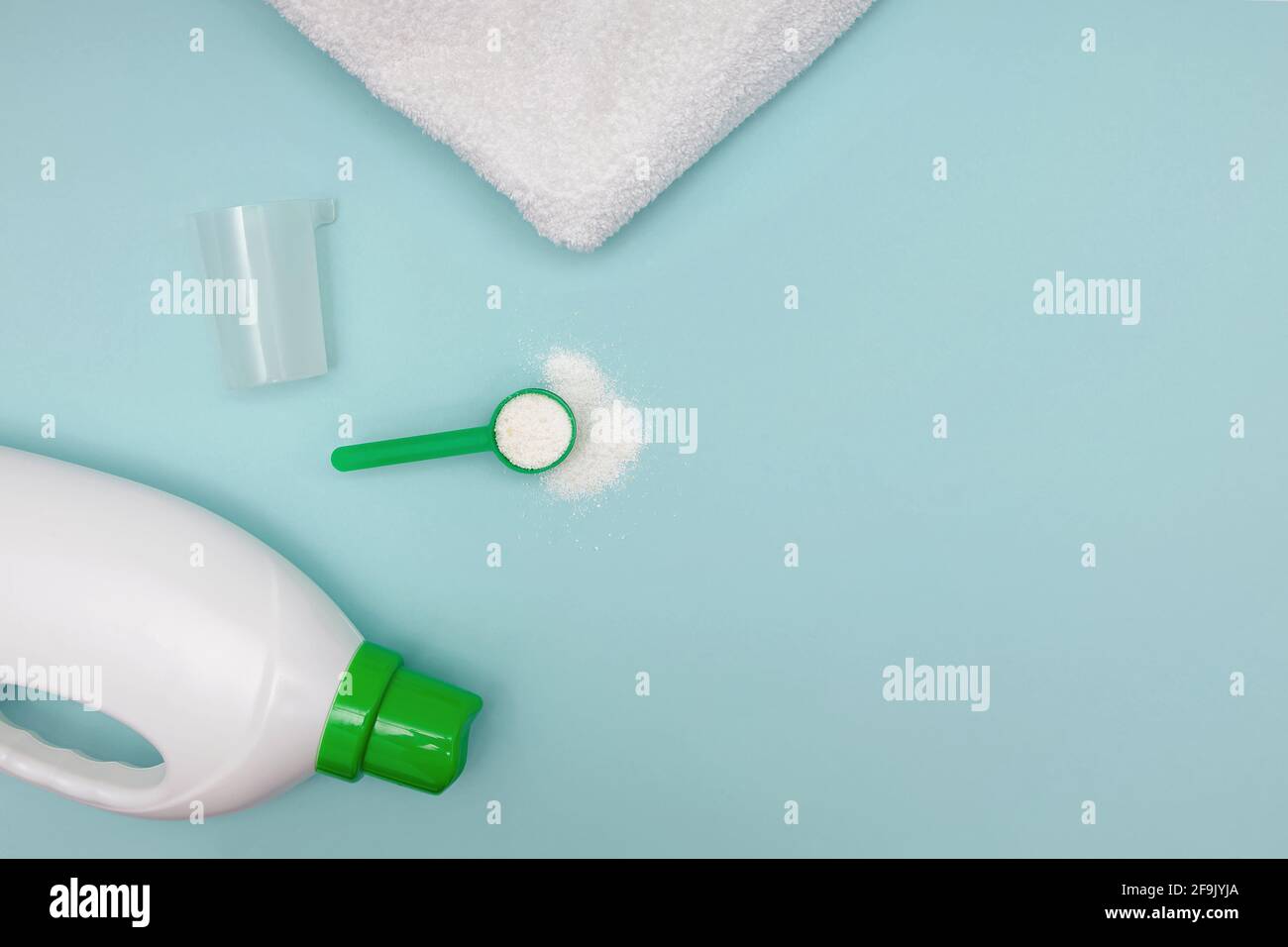 Washing liquid, powder detergent and clean white towel Stock Photo - Alamy