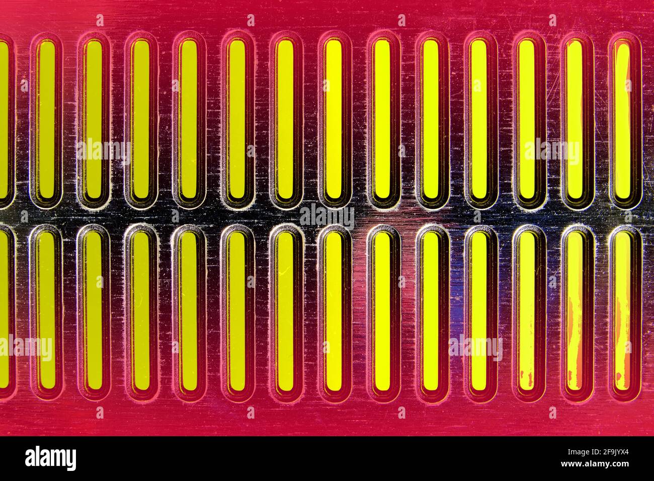 Red and yellow metallic grill Stock Photo - Alamy