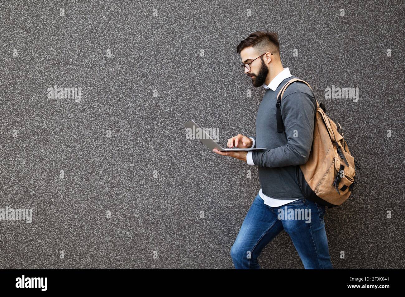 Professional man walking laptop computer hi-res stock photography and ...