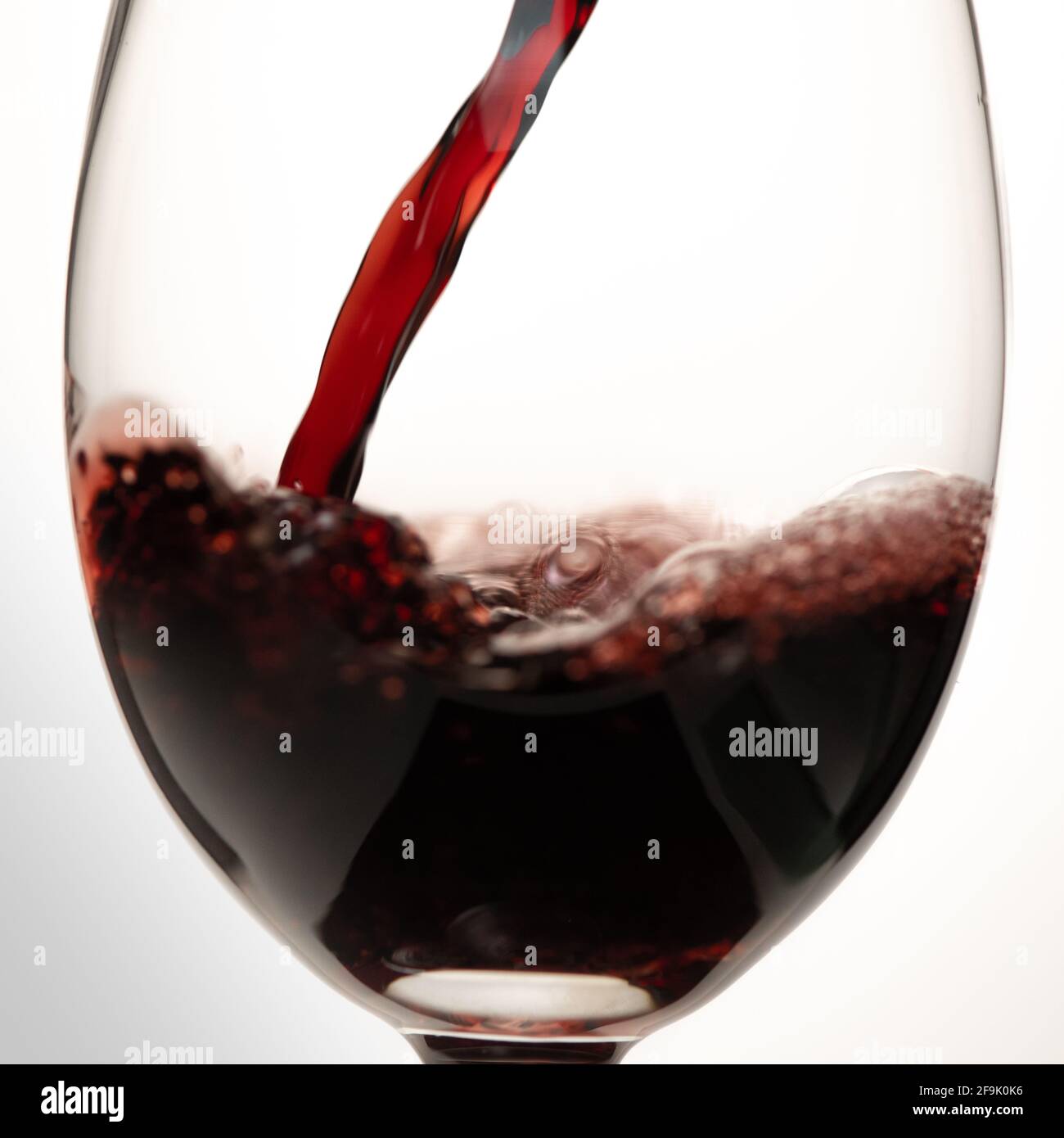 Red vine being pouring into a glass closeup vine splashing splash Stock ...