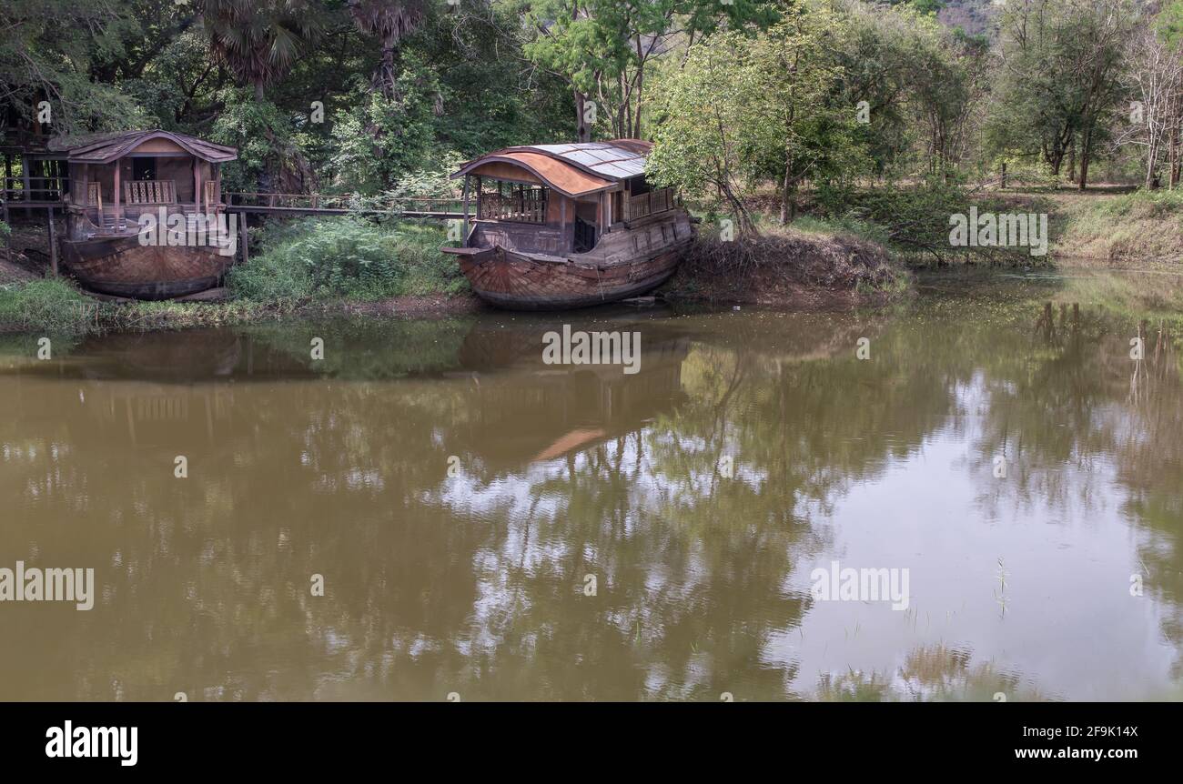 Two traditional house boats that was moored on the edge of the canal ...