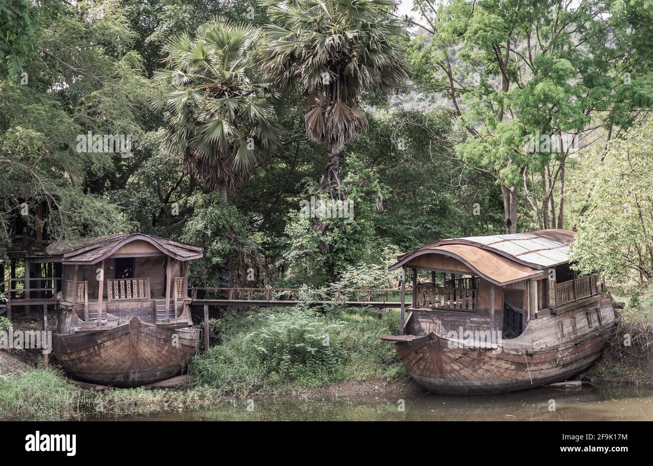 Two traditional house boats that was moored on the edge of the canal ...