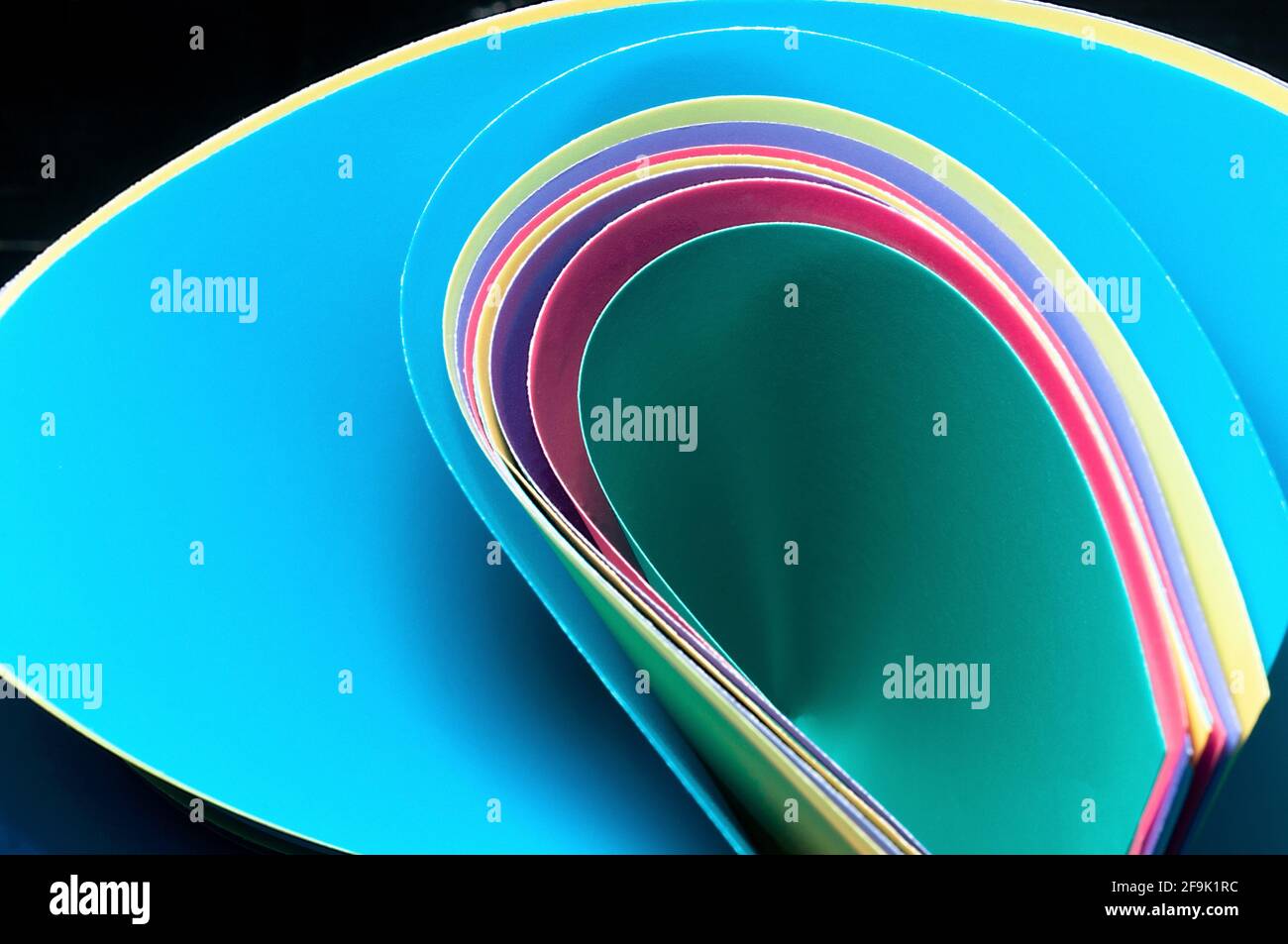 Design funnel by colored paper sheets in black background Stock Photo ...