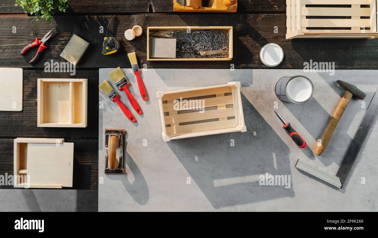 Top view of group of tools for making wooden boxes, small business and ...