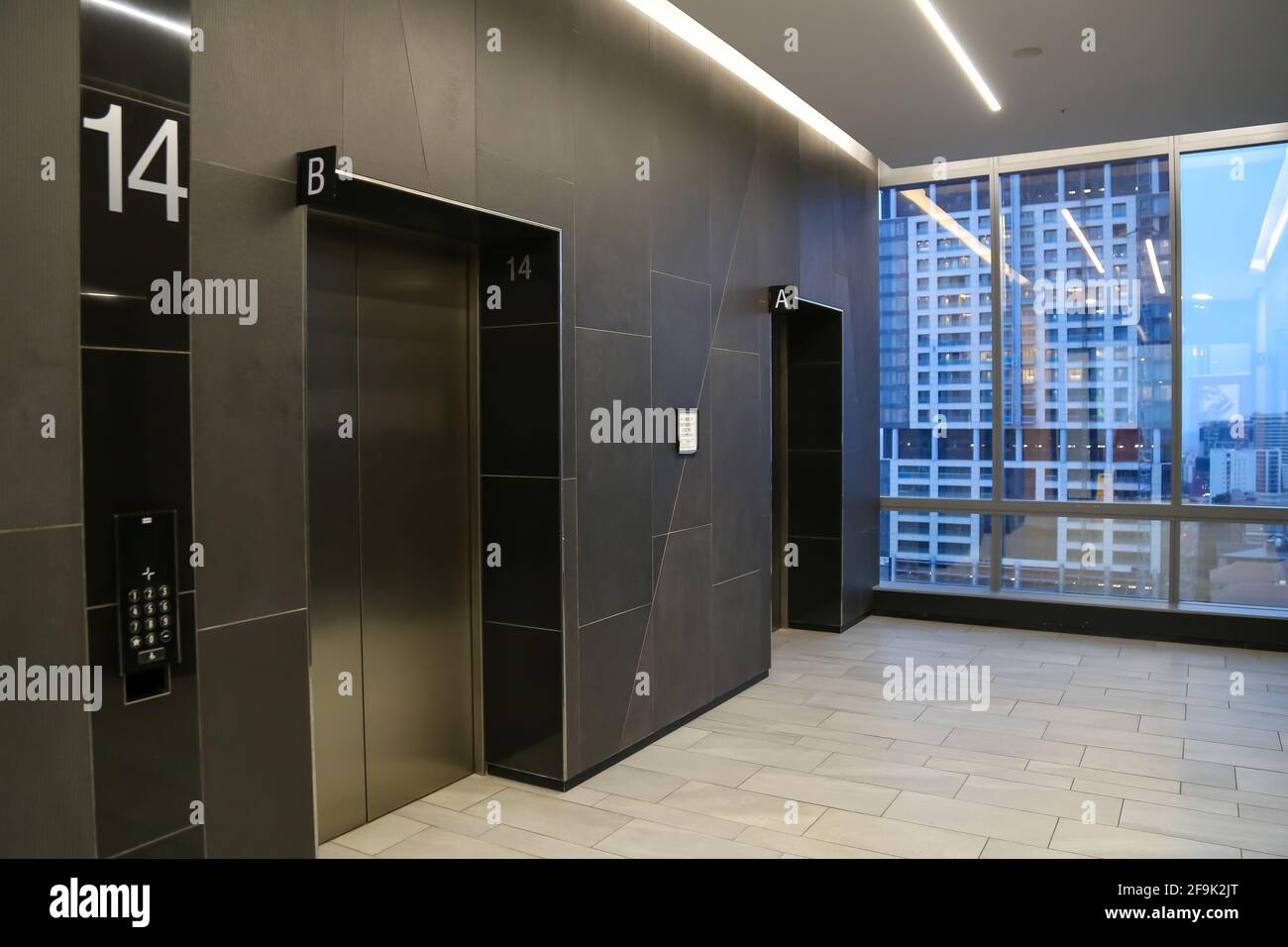 elevator in lobby with cityscape Stock Photo - Alamy