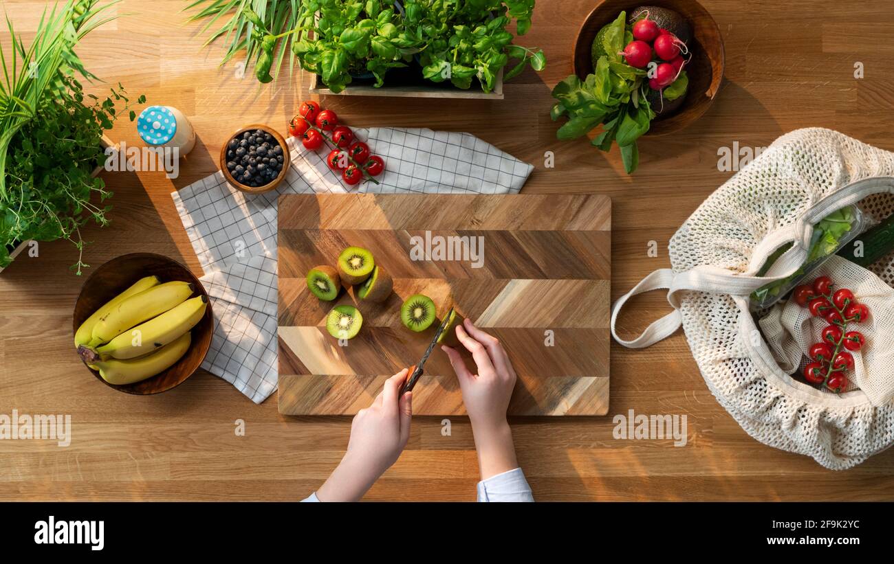 Top view of unrecognizable woman preparing fruit and vegetables ...