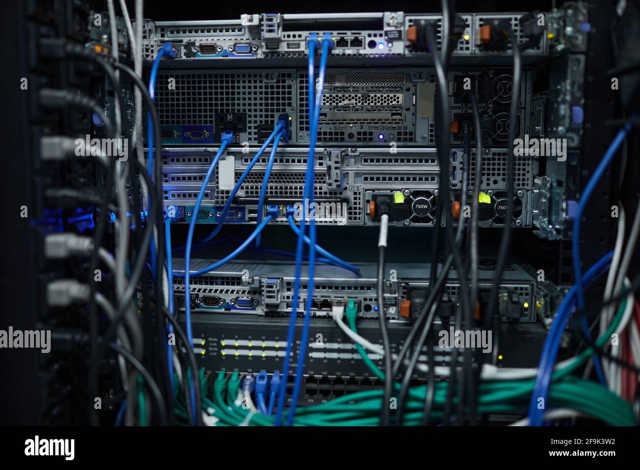 Background close up of server cabinet with cables and wires in data ...