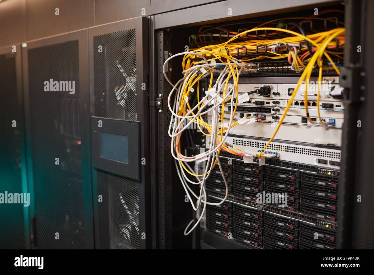 Background image of server cabinet with cables and wires at data center ...