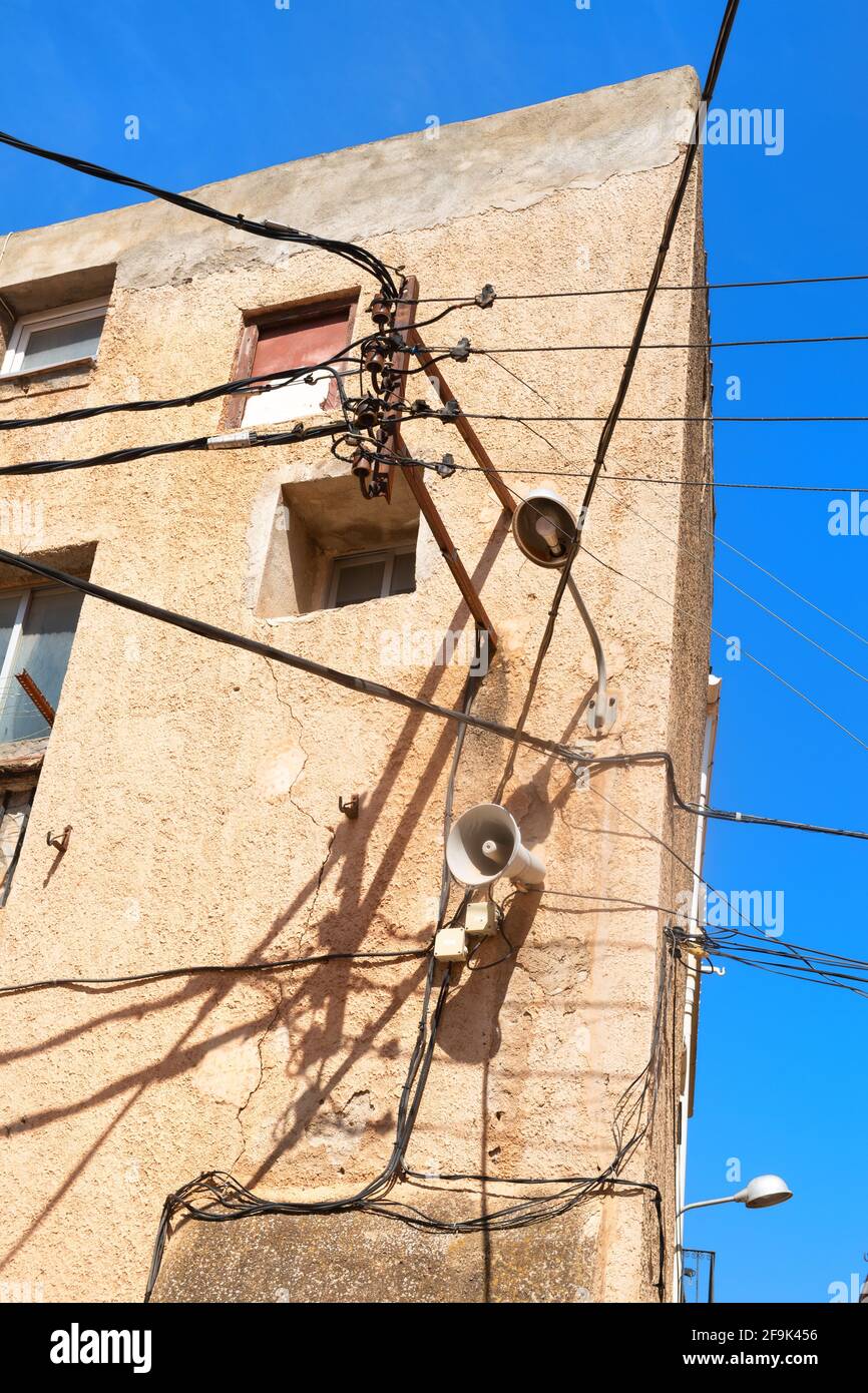 Typical electricity and electricity wires on old house in Spain Stock ...