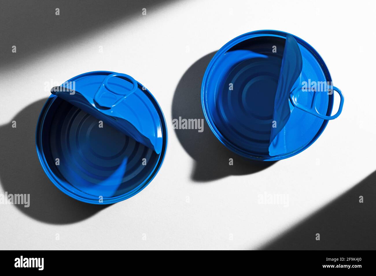 Painted blue opened tin can with ring on white background Stock Photo ...