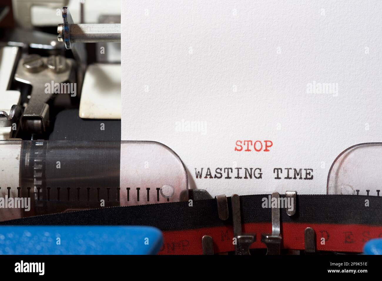 Stop wasting time phrase written with a typewriter Stock Photo - Alamy
