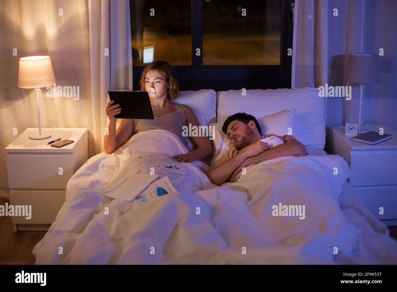Woman computer night bed hi-res stock photography and images - Alamy
