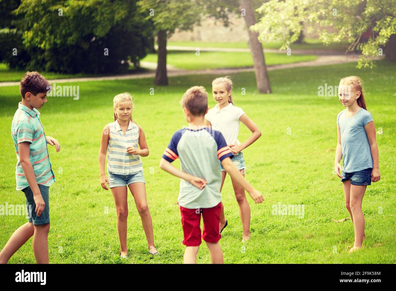 happy kids playing game in summer park Stock Photo - Alamy