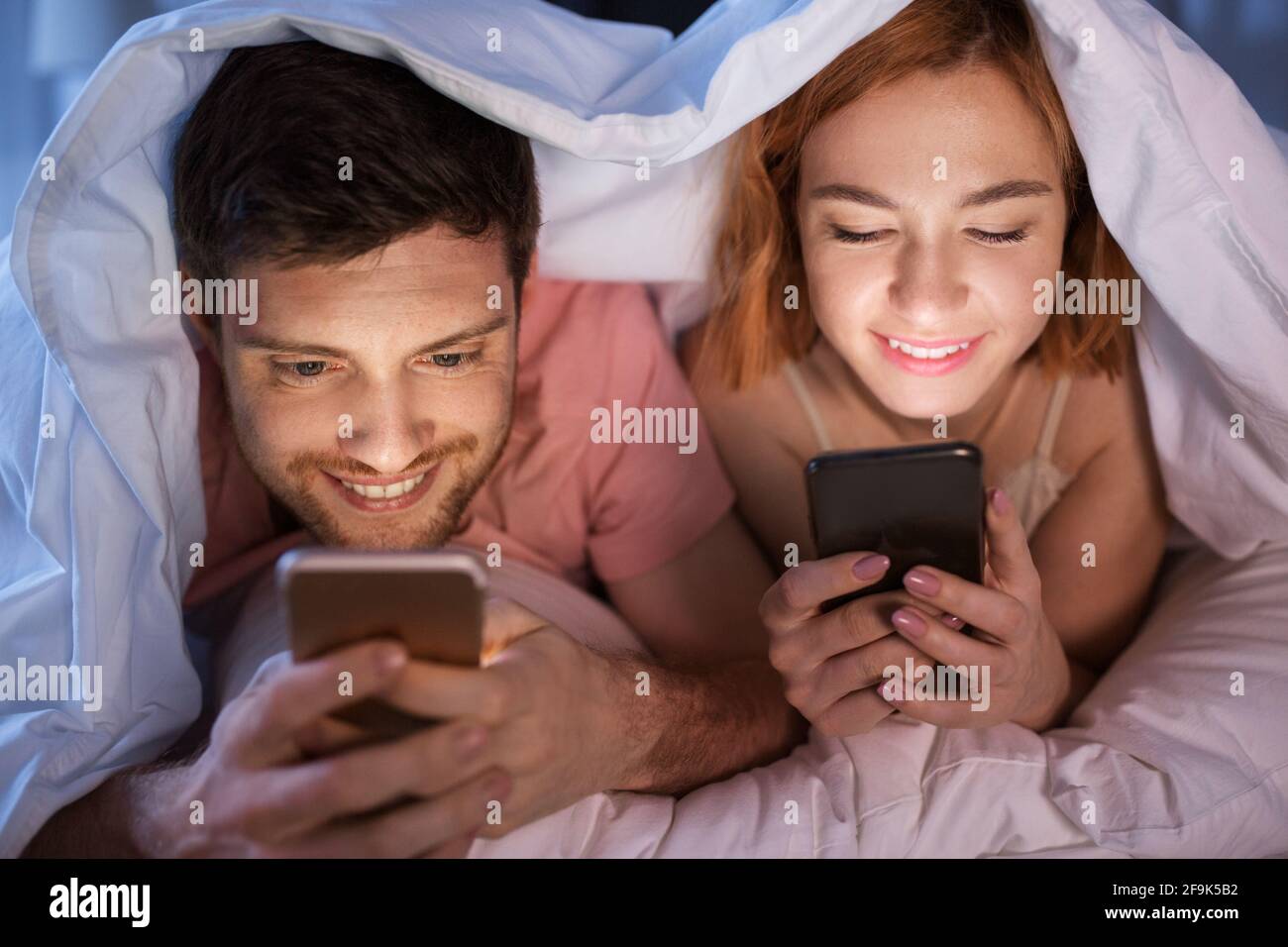 Happy couple night in bed hi-res stock photography and images - Alamy