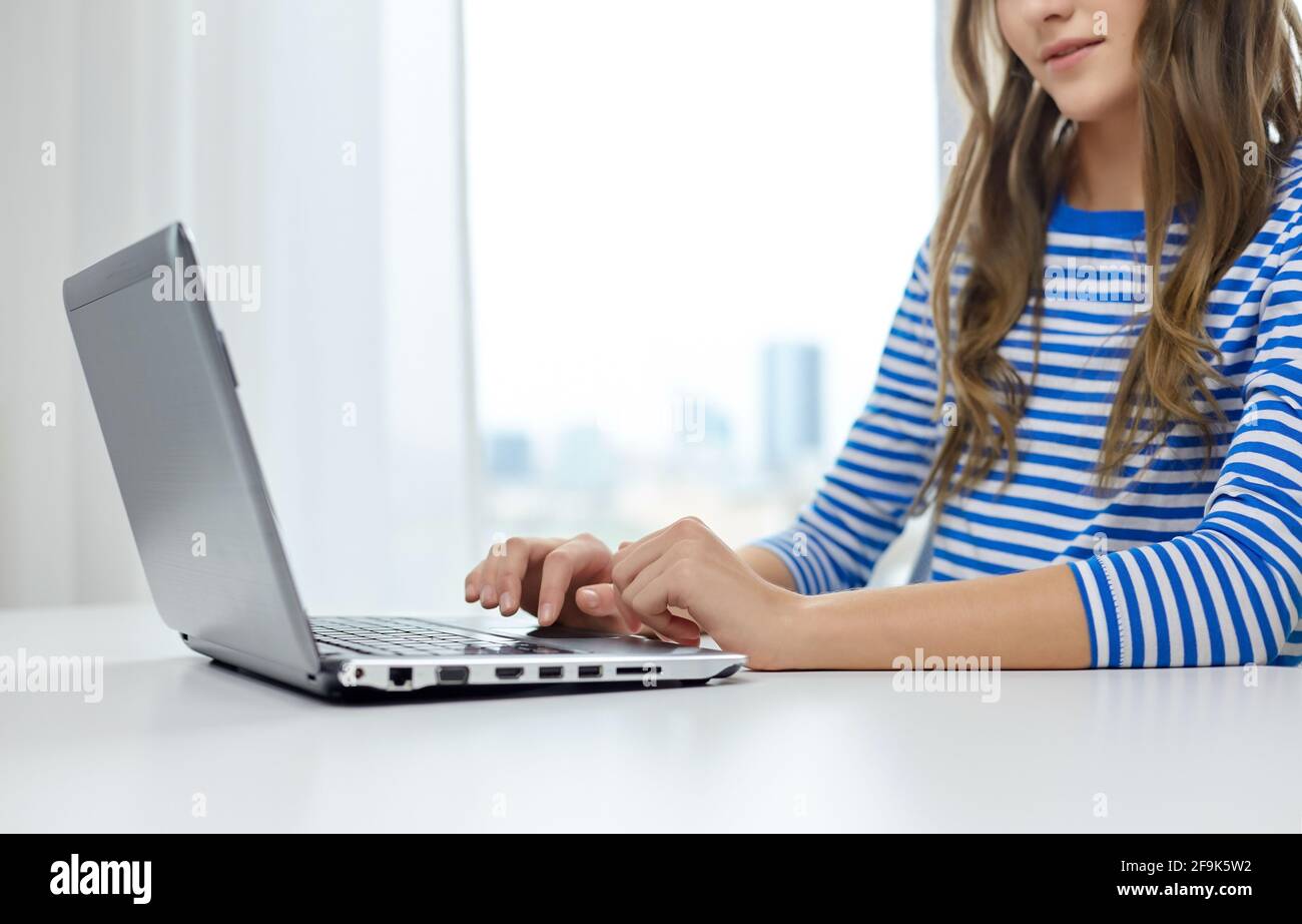 student girl typing on laptop computer Stock Photo - Alamy