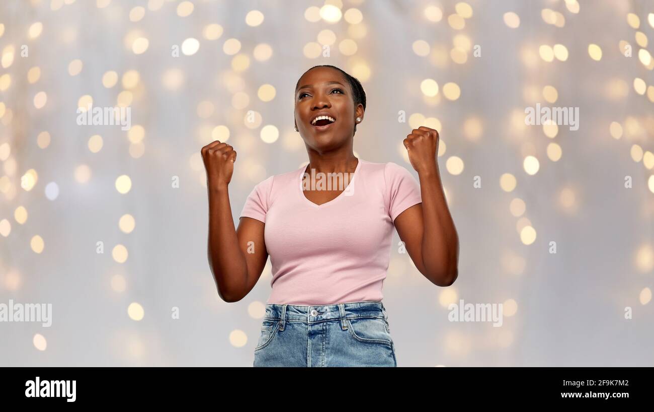happy african american woman celebrating success Stock Photo - Alamy