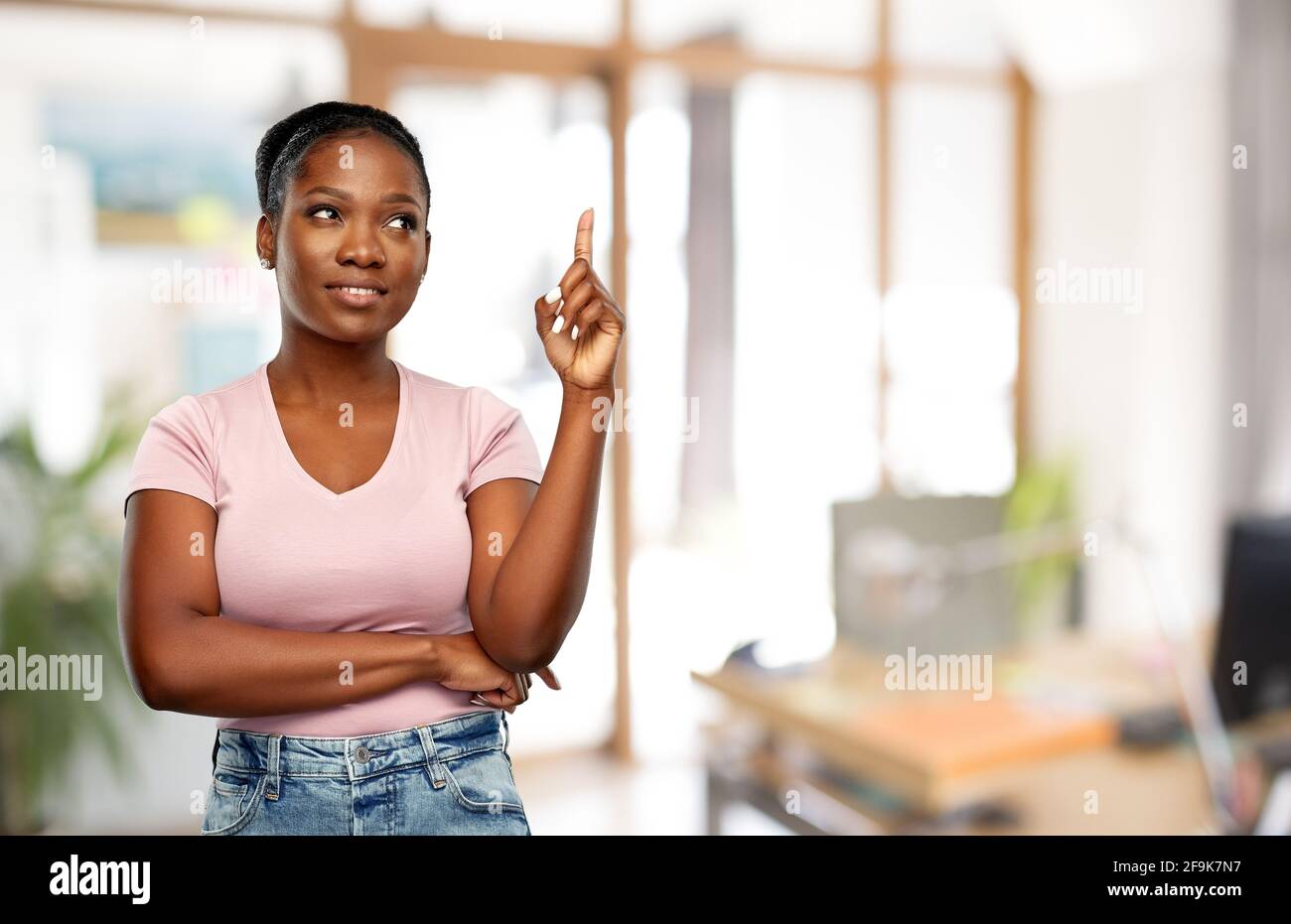 happy african american woman pointing finger up Stock Photo - Alamy