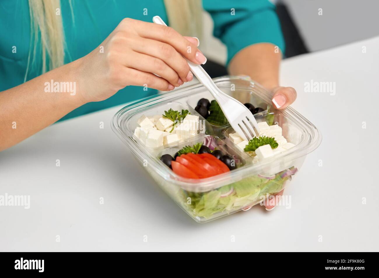 Woman eating take out hi-res stock photography and images - Alamy