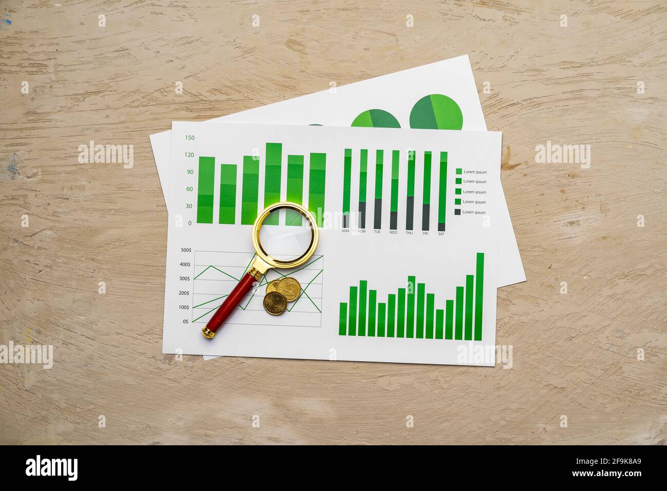 Financial paper with charts and diagrams on gray table Stock Photo - Alamy