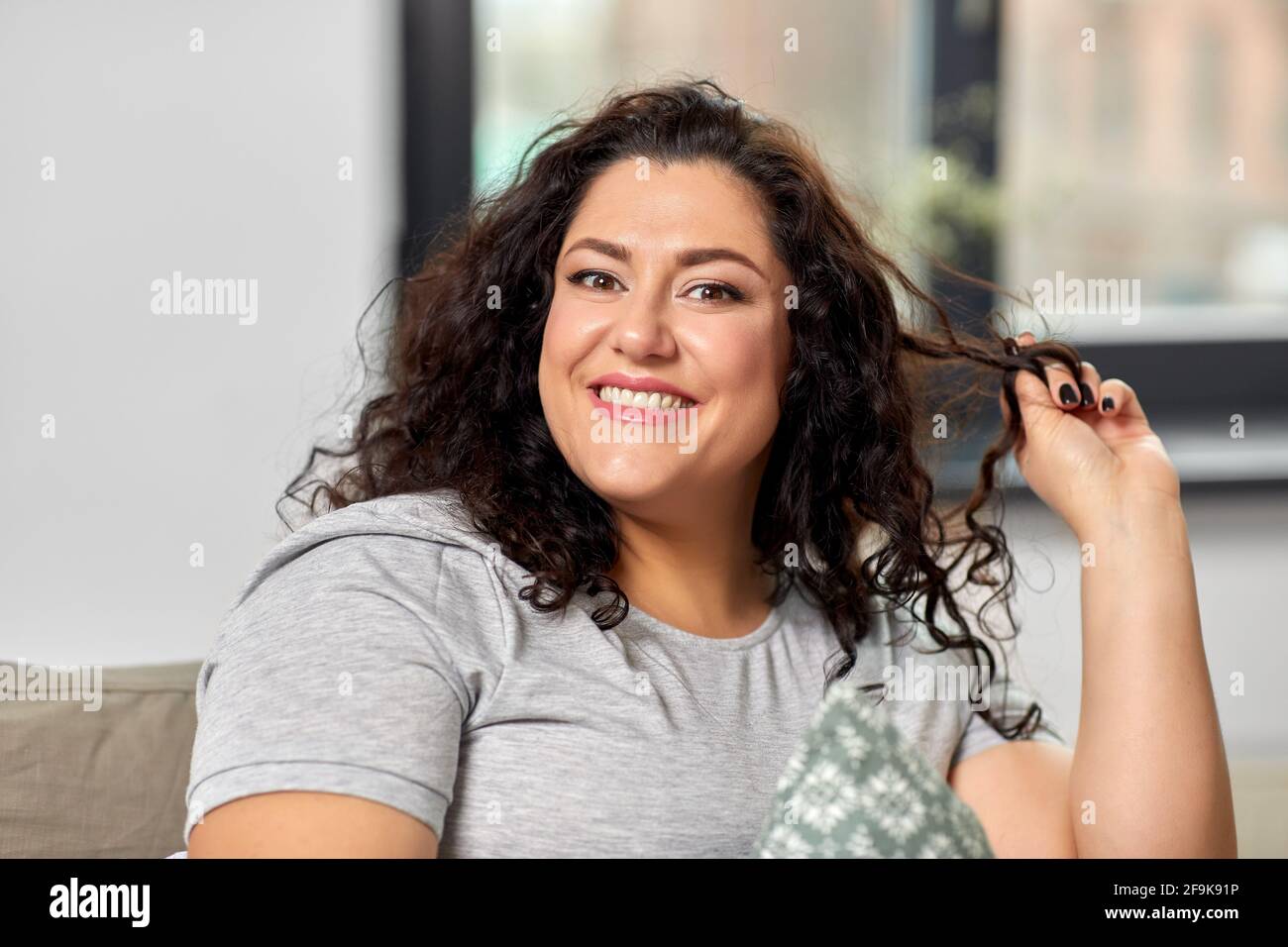 portrait of happy young woman at home Stock Photo - Alamy