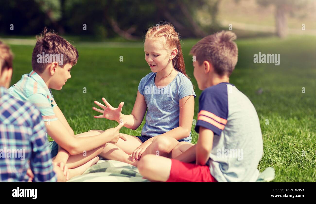 happy kids playing rock-paper-scissors game Stock Photo - Alamy