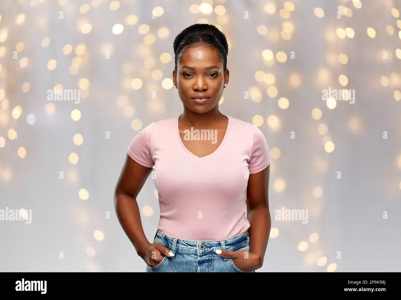 african american woman over lights background Stock Photo - Alamy