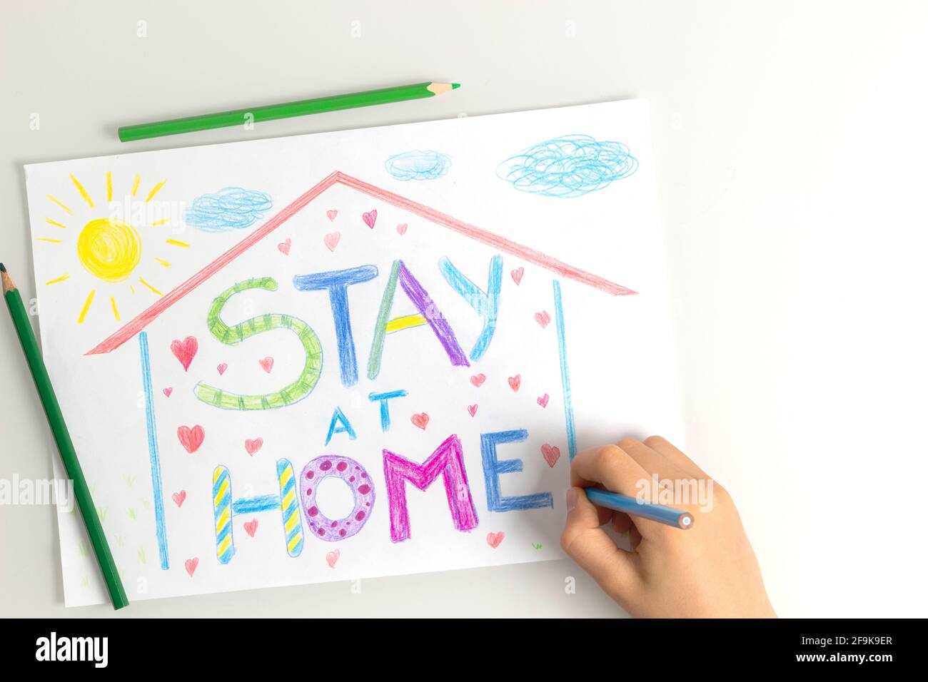 Quarantine at home during coronavirus pandemic. Kid hand drawing with ...