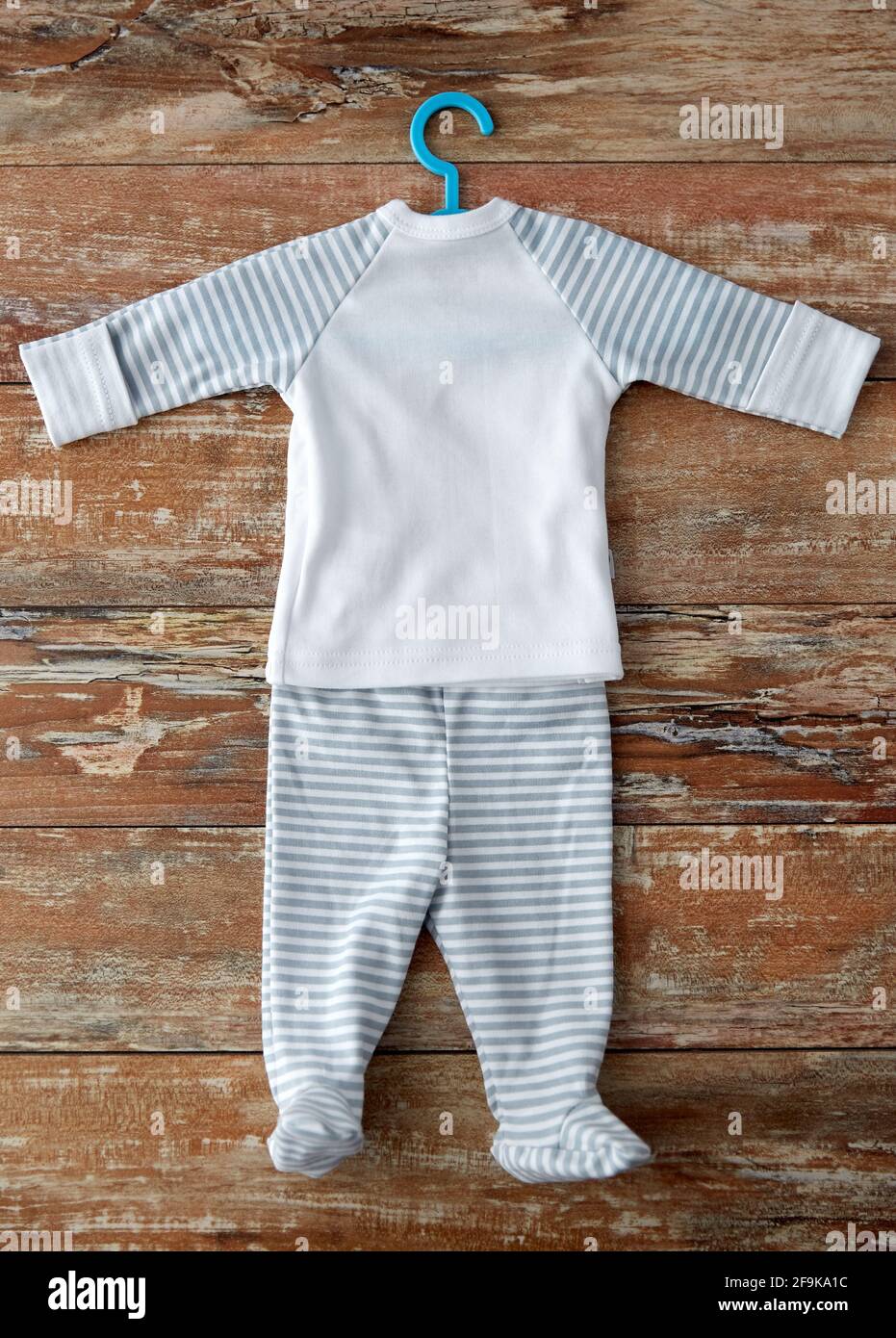 Baby clothes hanger hi-res stock photography and images - Alamy