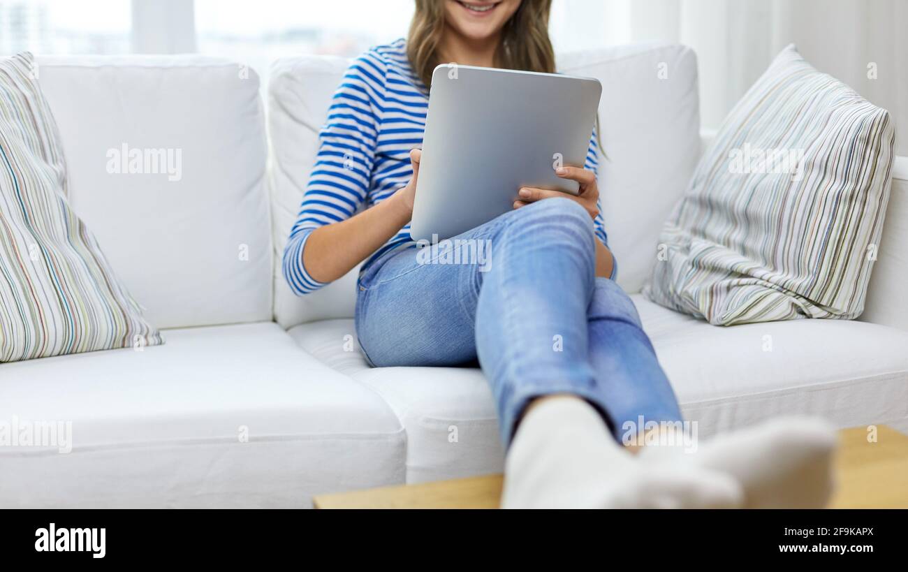 teenage girl with tablet pc computer at home Stock Photo - Alamy