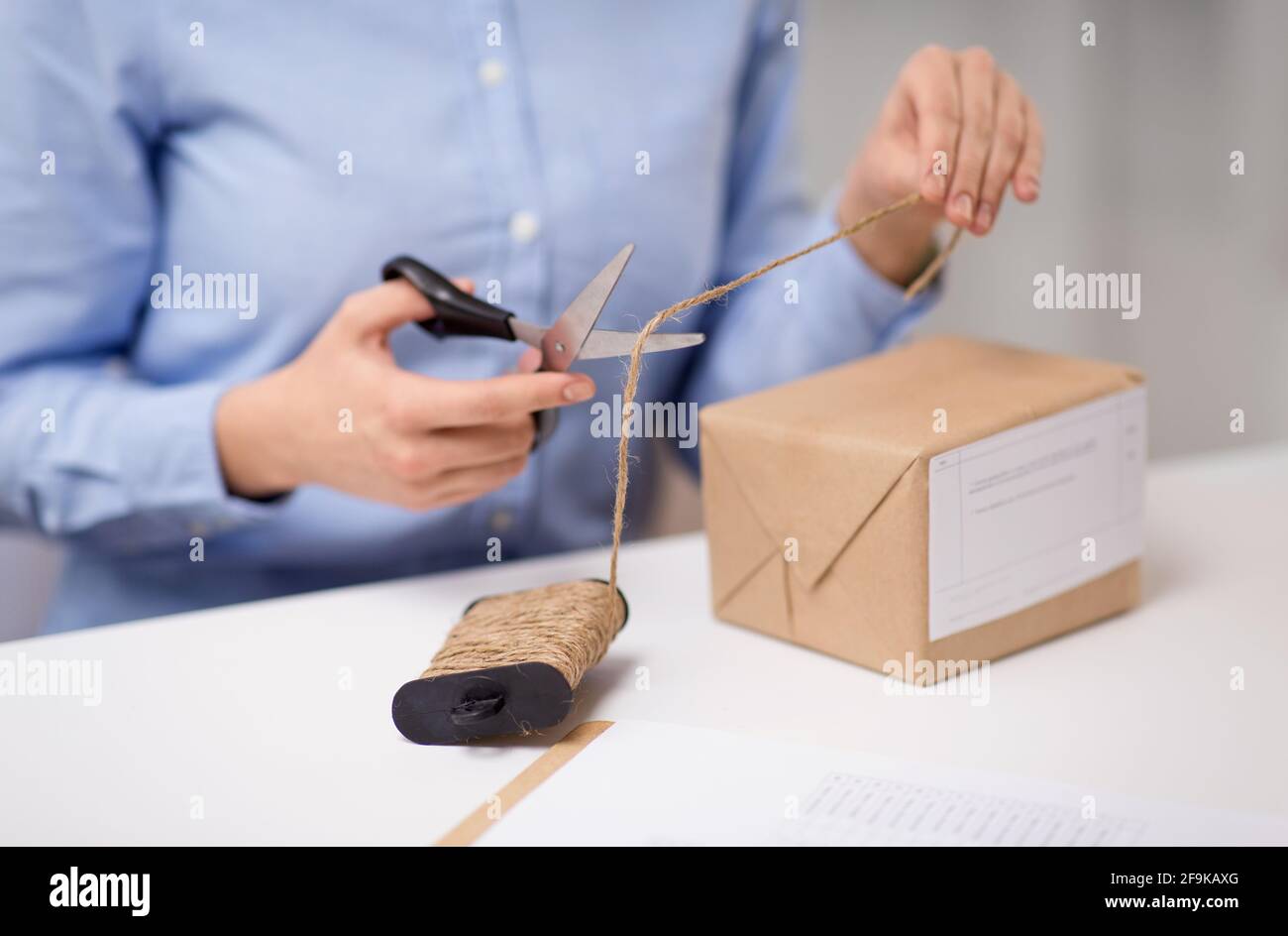 Scissors cutting rope hi-res stock photography and images - Alamy